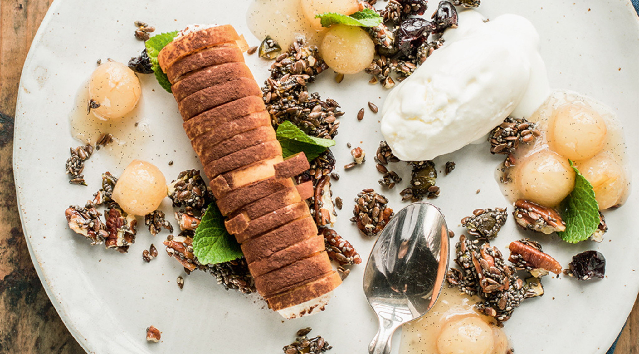 White mousse cannoli with marinated pears, granola and yogurt cream ic